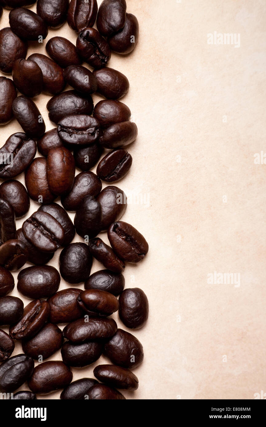 coffee beans on a parchment paper background Stock Photo - Alamy