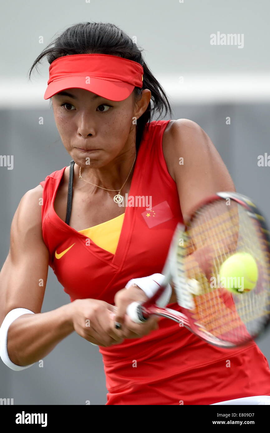 Incheon, South Korea. 27th Sep, 2014. Wang Qiang of China returns the ...