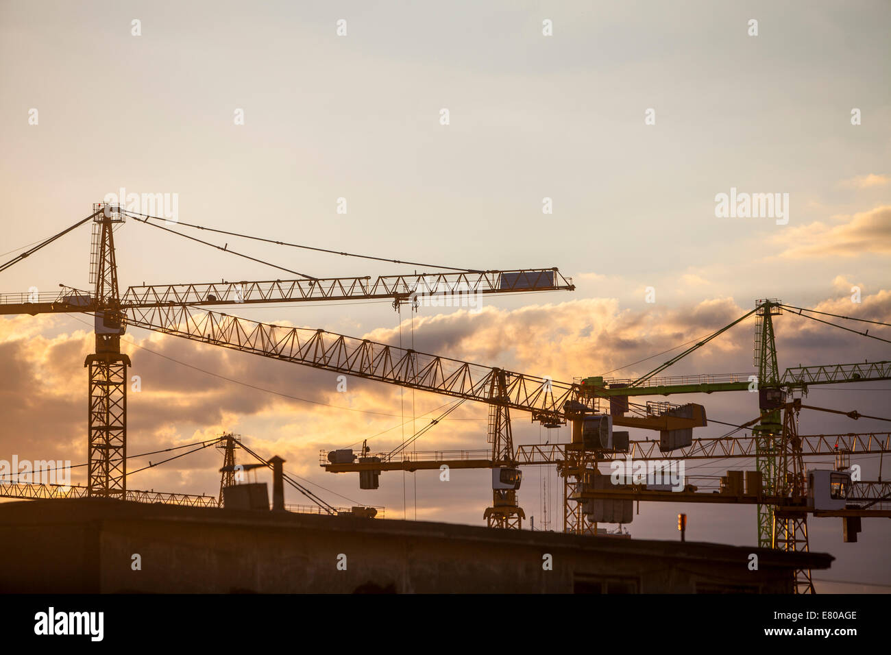 Color picture of some cranes on a construction site, as dusk Stock ...