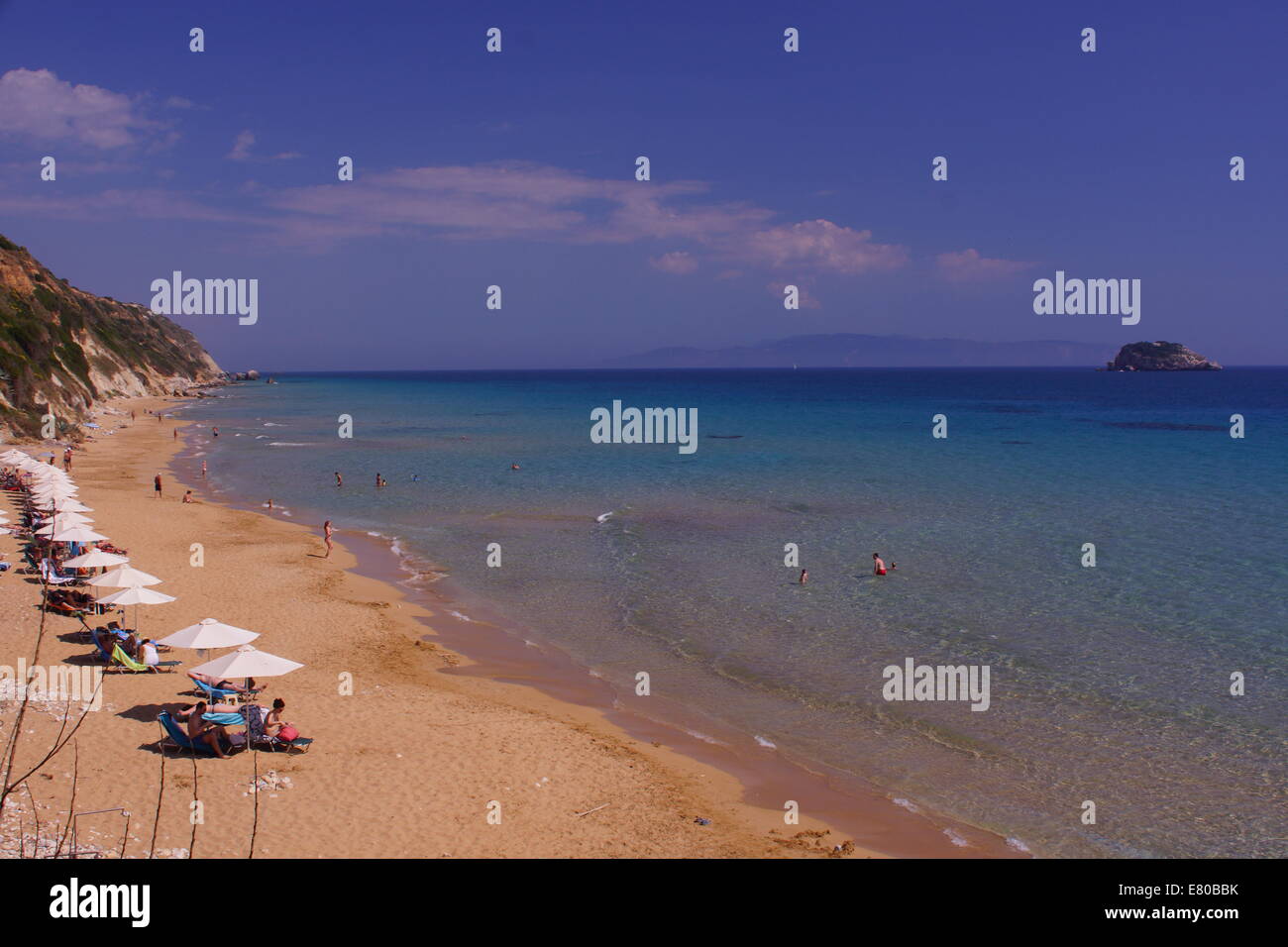 Typical day at the beach, sun, sand, sea, blue sky Stock Photo - Alamy