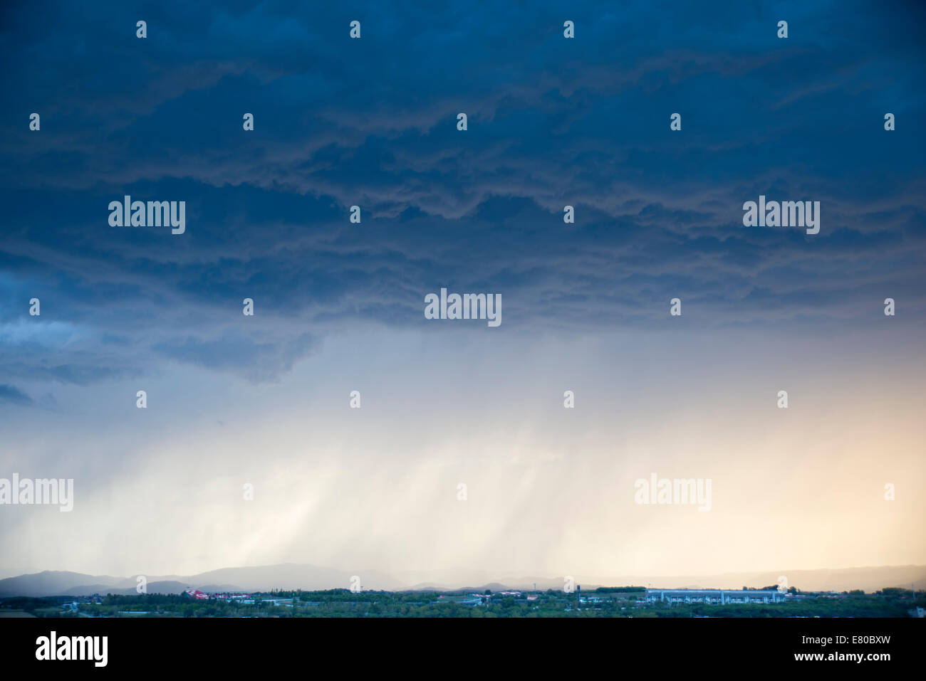 storm with heavy showers chaotic sky Stock Photo - Alamy