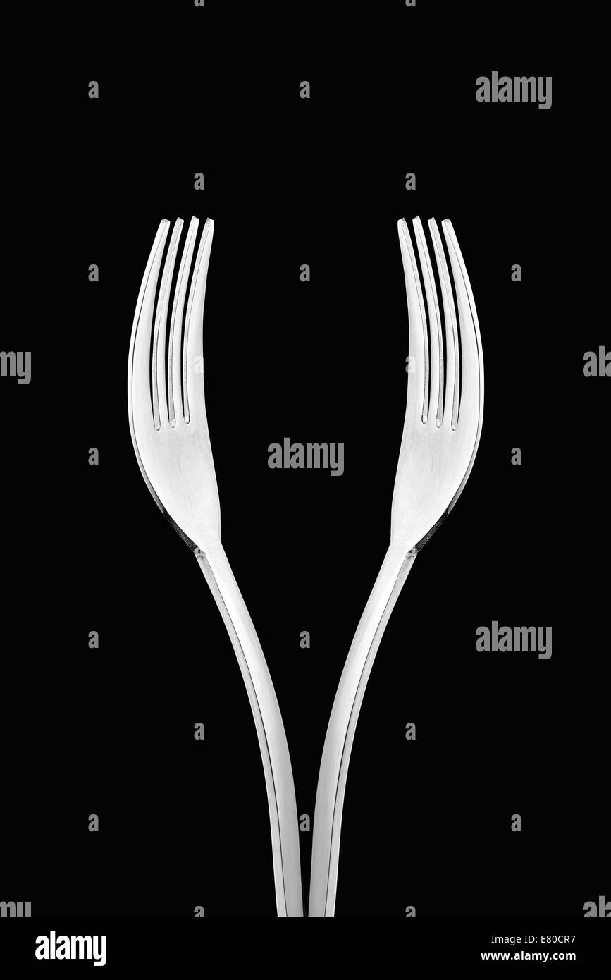Artistic cup of wine form or hands form made with two forks isolated on ...