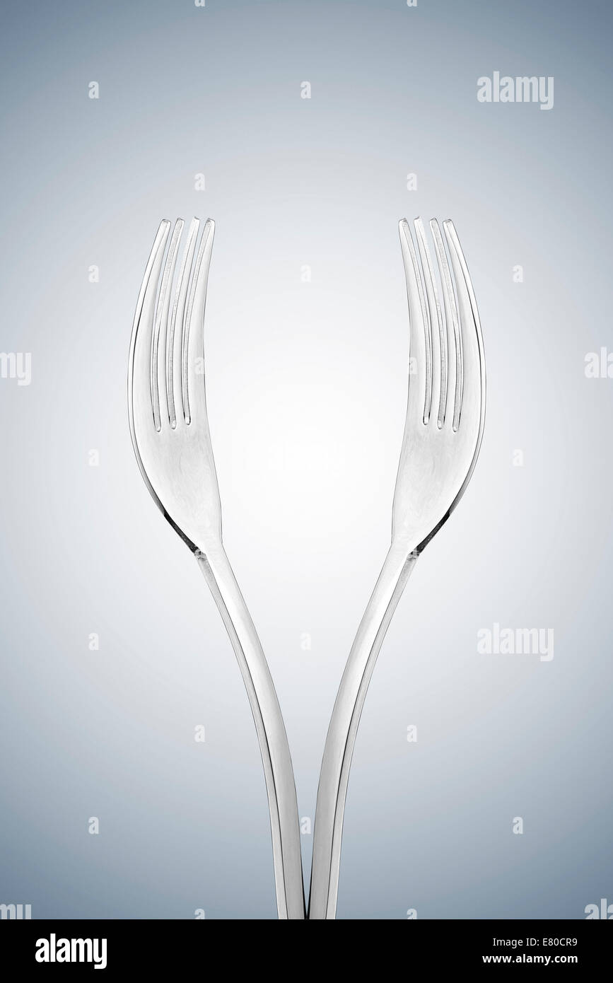 Artistic cup of wine form or hands form made with two forks isolated on ...