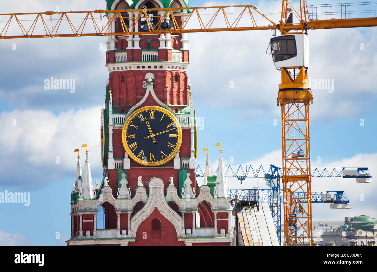 Kremlin clock up view with construction cranes Stock Photo - Alamy