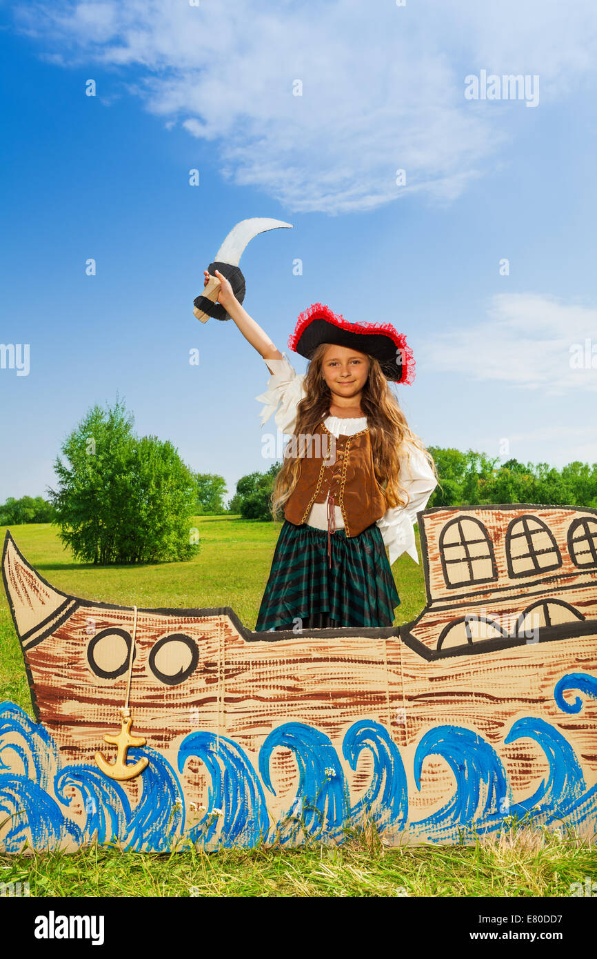 Girl in costume of pirate with black hat and sword Stock Photo - Alamy