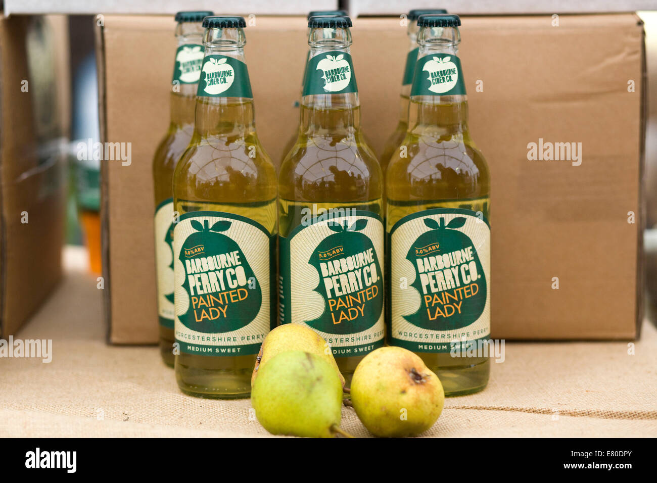 Bottles of Painted lady cider and pears on a table Stock Photo - Alamy