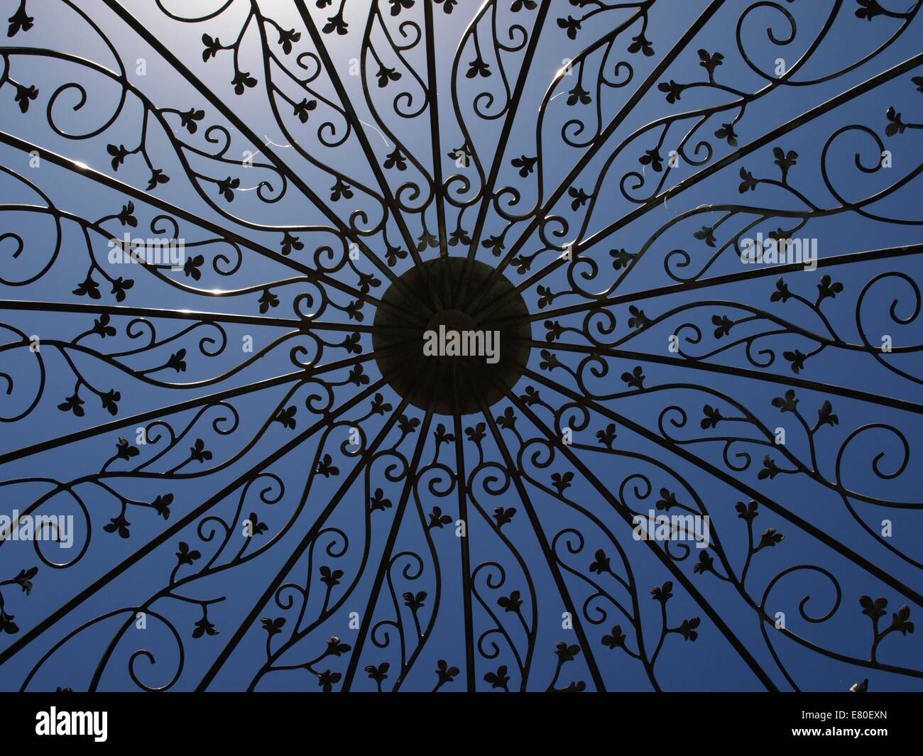 Intricate wrought iron work against a blue sky background Stock Photo ...
