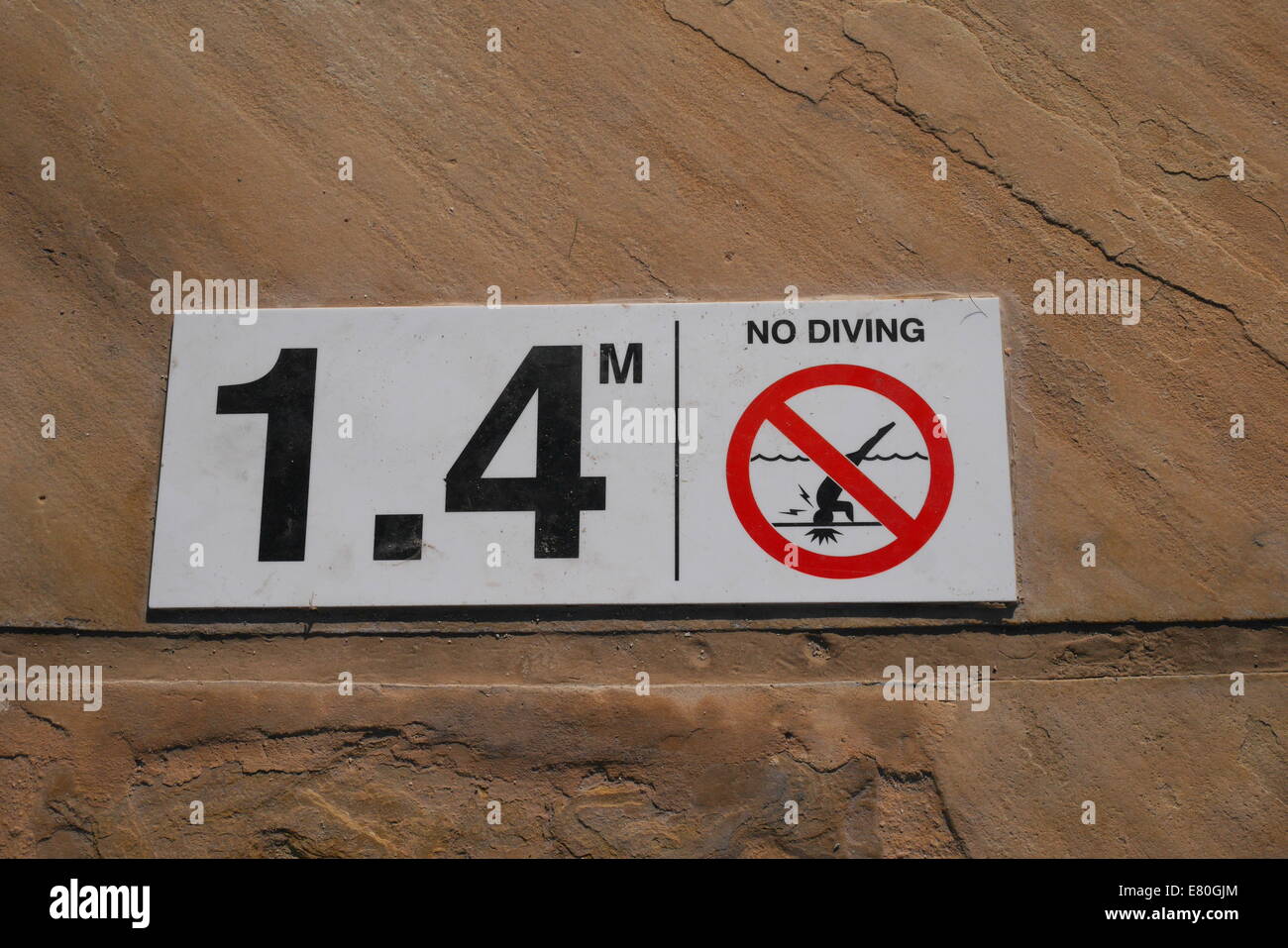 Information about water depth and a no-diving warning at the edge of a ...