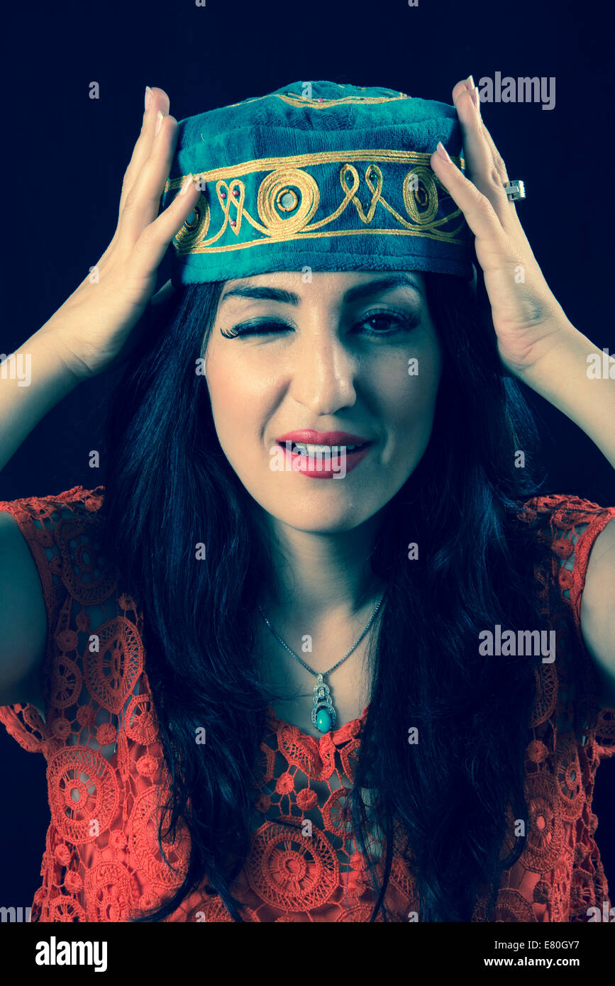 Woman wearing traditional middle eastern hat Stock Photo - Alamy