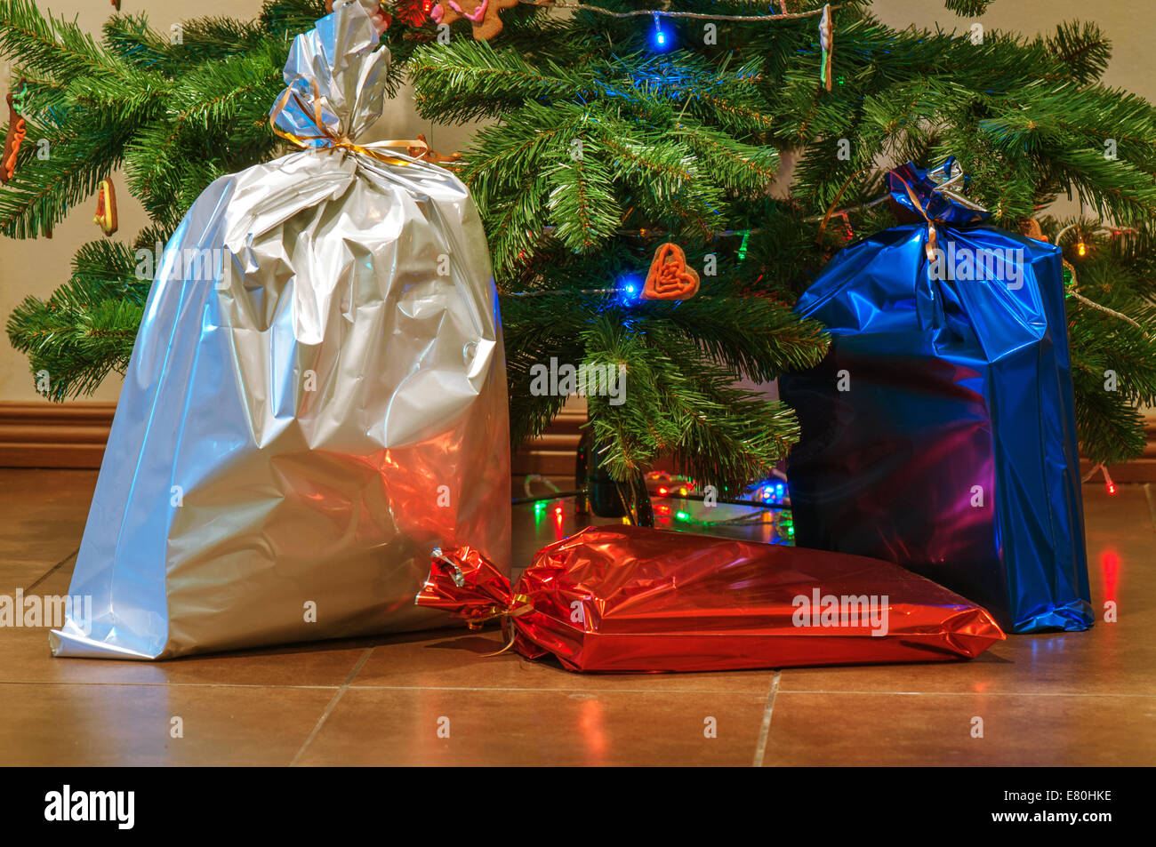 Christmas presents under the tree Stock Photo - Alamy