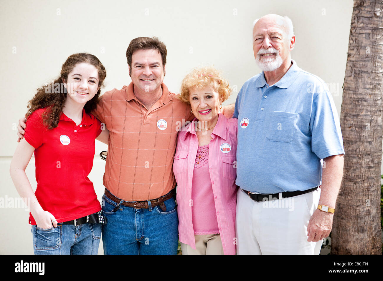 Family wearing their I Voted stickers on election day. (stickers are ...