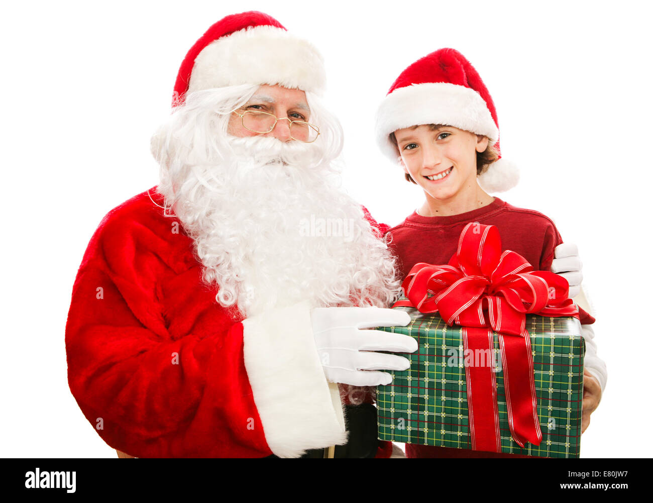 Santa giving a Christmas gift to a cute little boy. Isolated on white ...