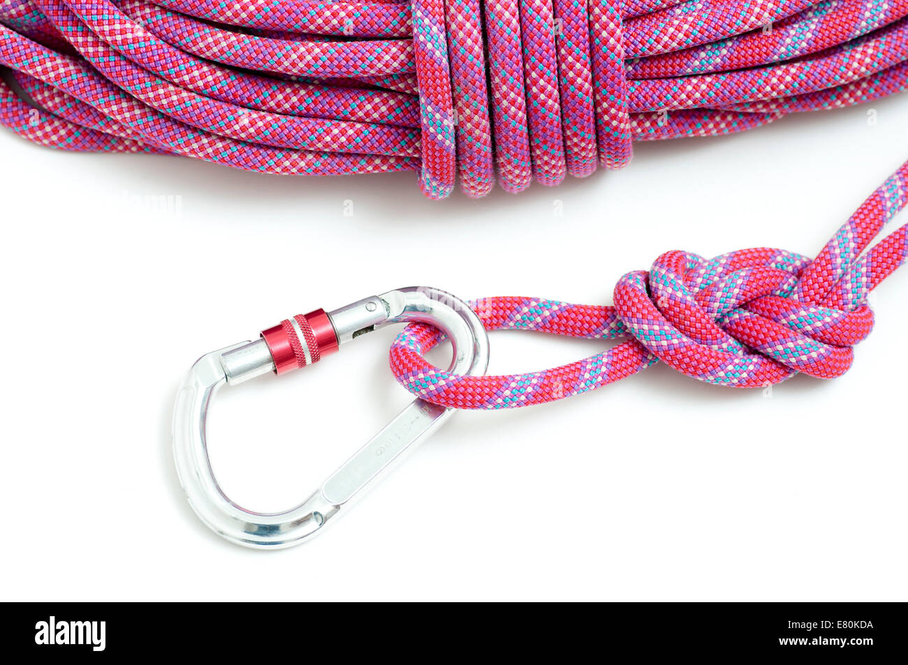 Carabiner attached to mountaineers rope, ready for climbing Stock Photo ...