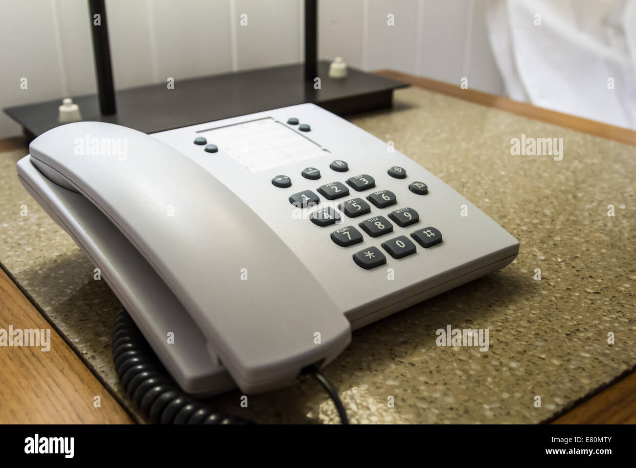 Telephone for customer service on table in hotel room Stock Photo - Alamy