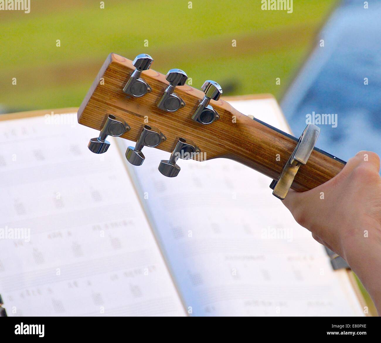Street performer playing acoustic guitar at square Stock Photo - Alamy