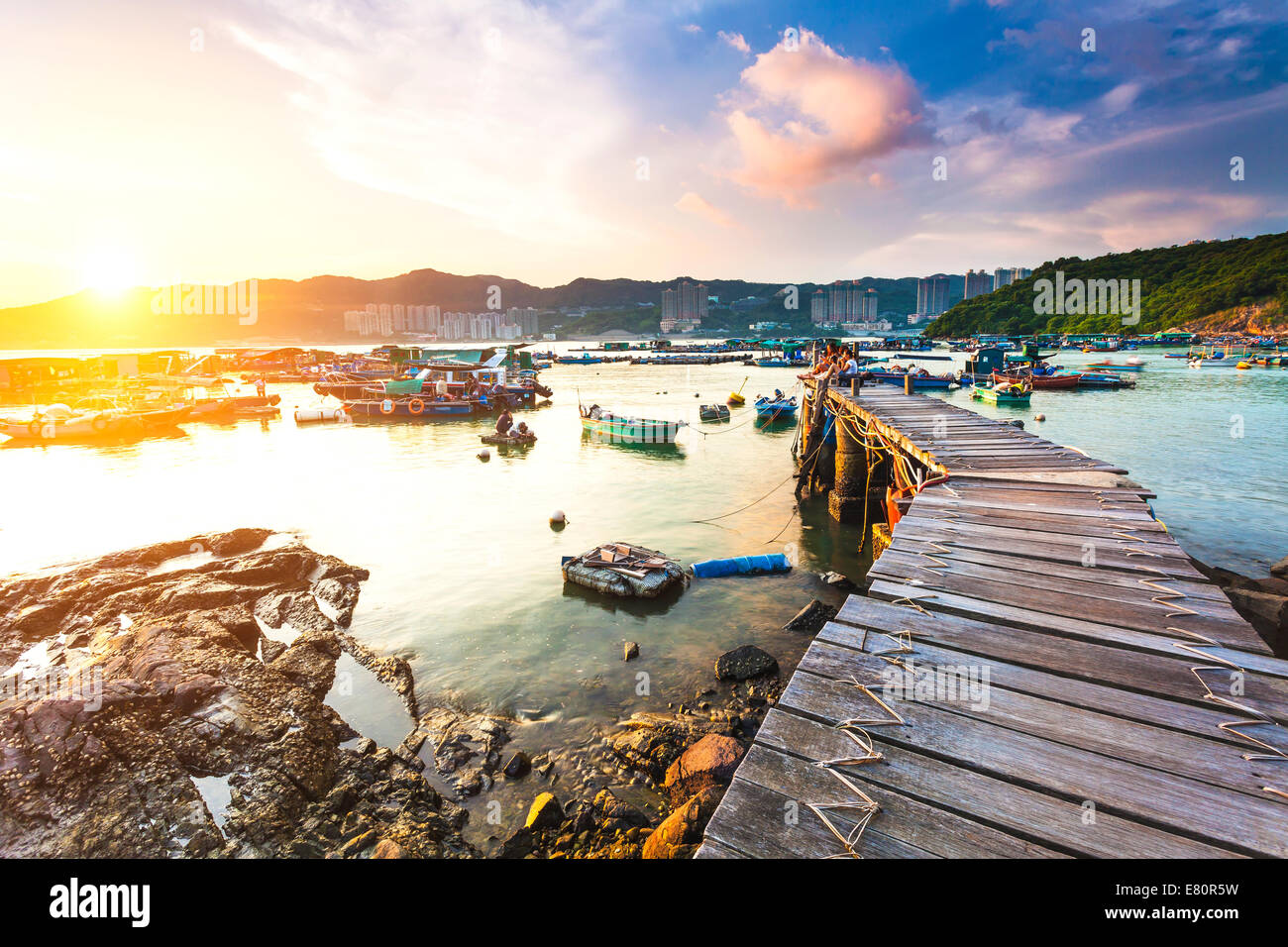 Fishing pier bridge at sunset Stock Photo - Alamy