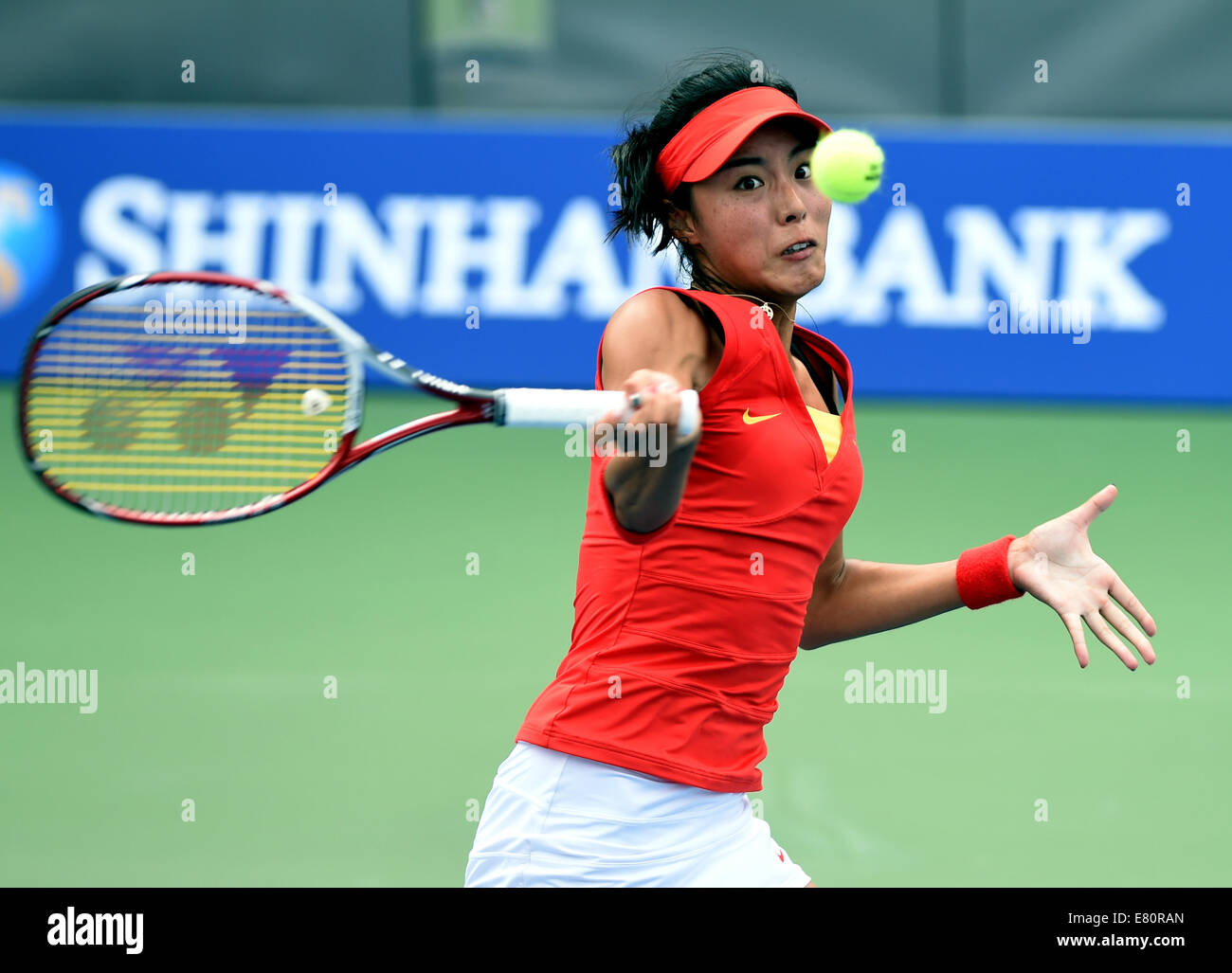 Incheon, South Korea. 28th Sep, 2014. Wang Qiang of China hits the ball ...