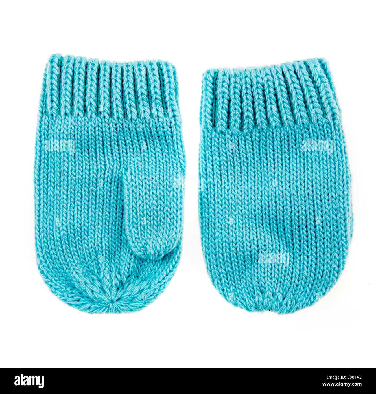 Baby woolen mittens on a white background Stock Photo - Alamy