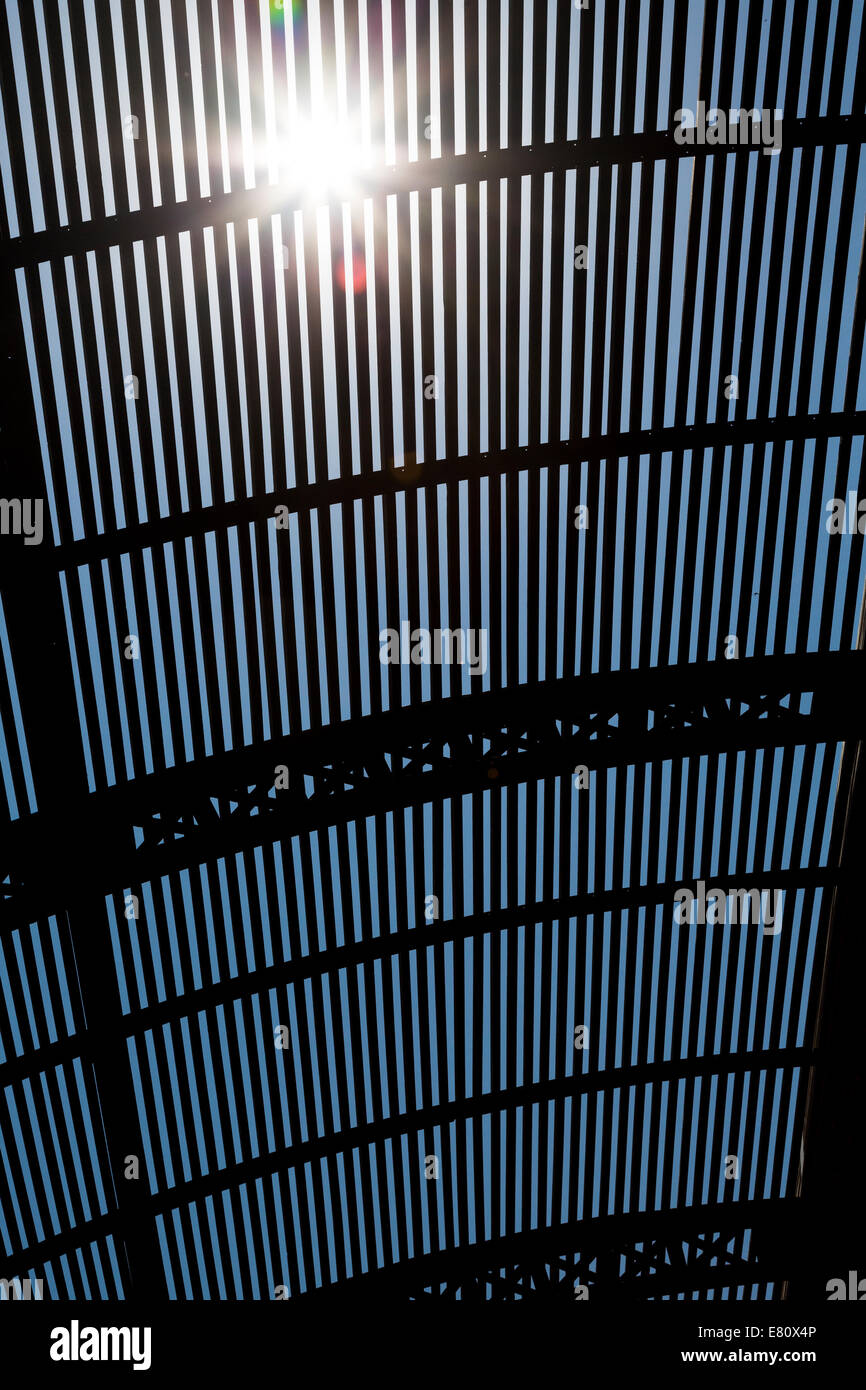 sun is shining through a wooden grid roof Stock Photo - Alamy