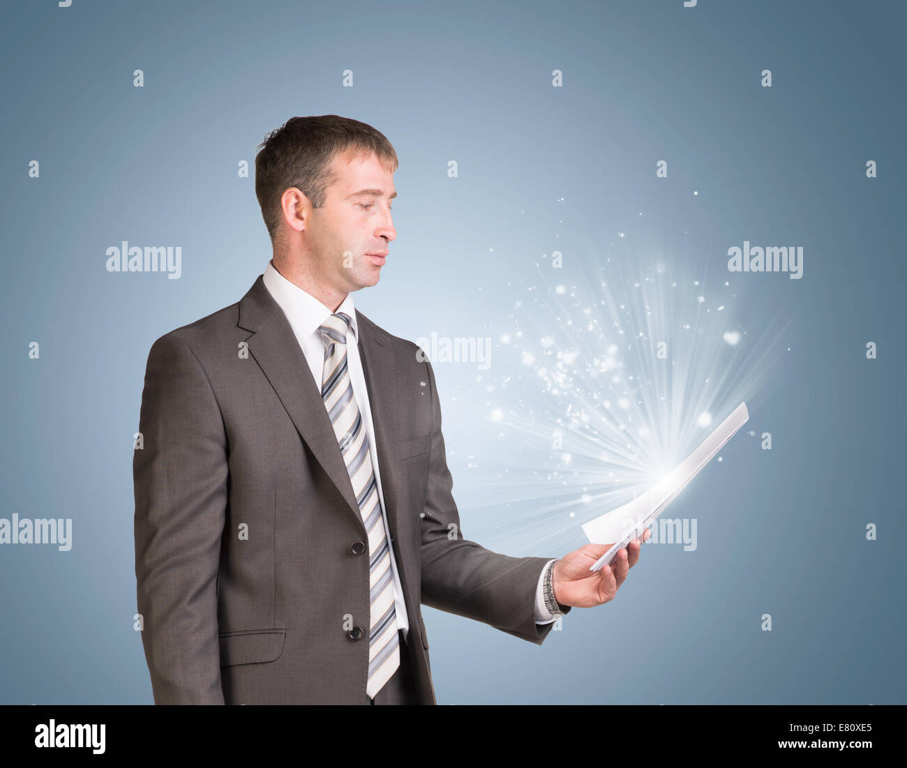 Businessman in suit hold paper sheets Stock Photo - Alamy