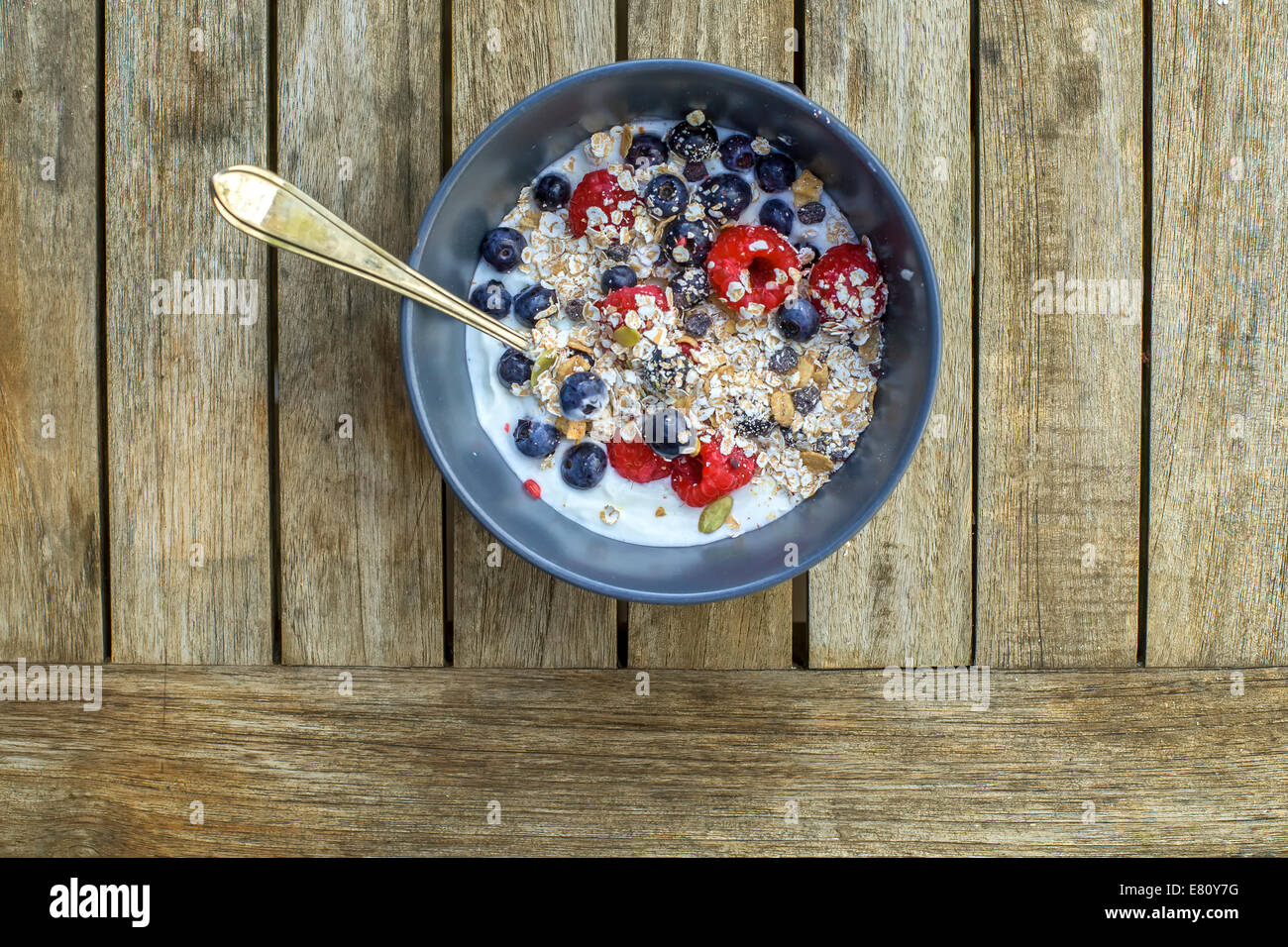 Yogurt with muesli and fresh fruit Stock Photo - Alamy