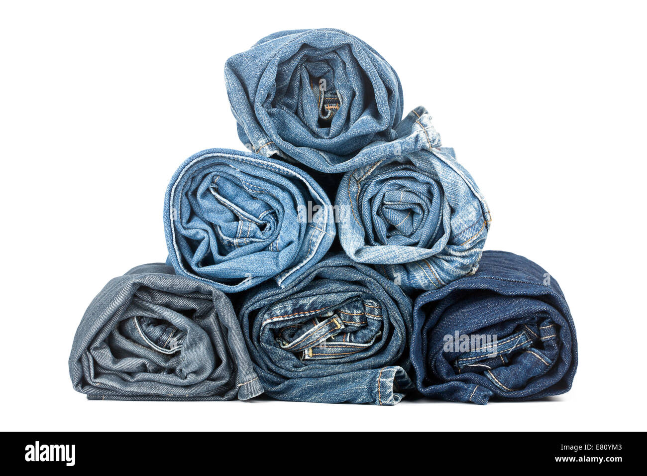 Stack of rolled jeans isolated on white background Stock Photo - Alamy