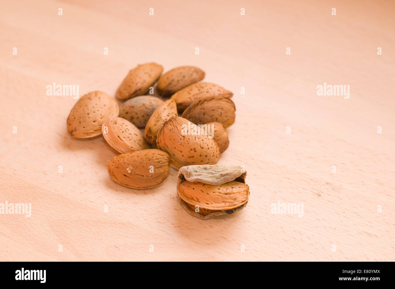 Group of almonds and one of them with its natural skin Stock Photo - Alamy