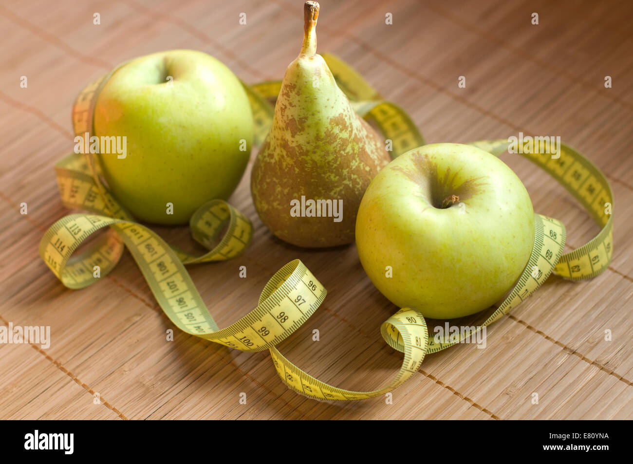 Apple and metric ribbon, food for a healthy lifestyle Stock Photo - Alamy