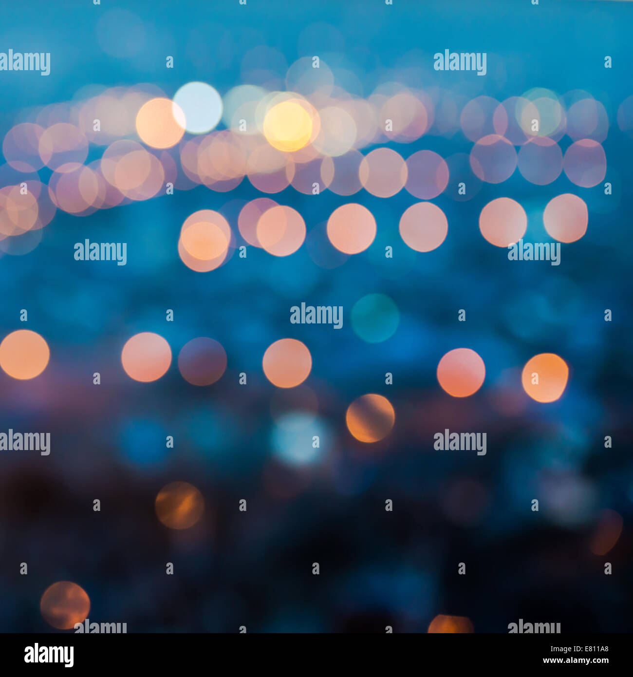 city blurring lights abstract circular bokeh on blue background ...
