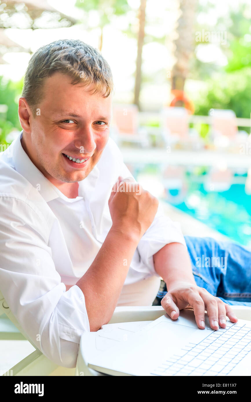 Laptop by the pool hi-res stock photography and images - Alamy