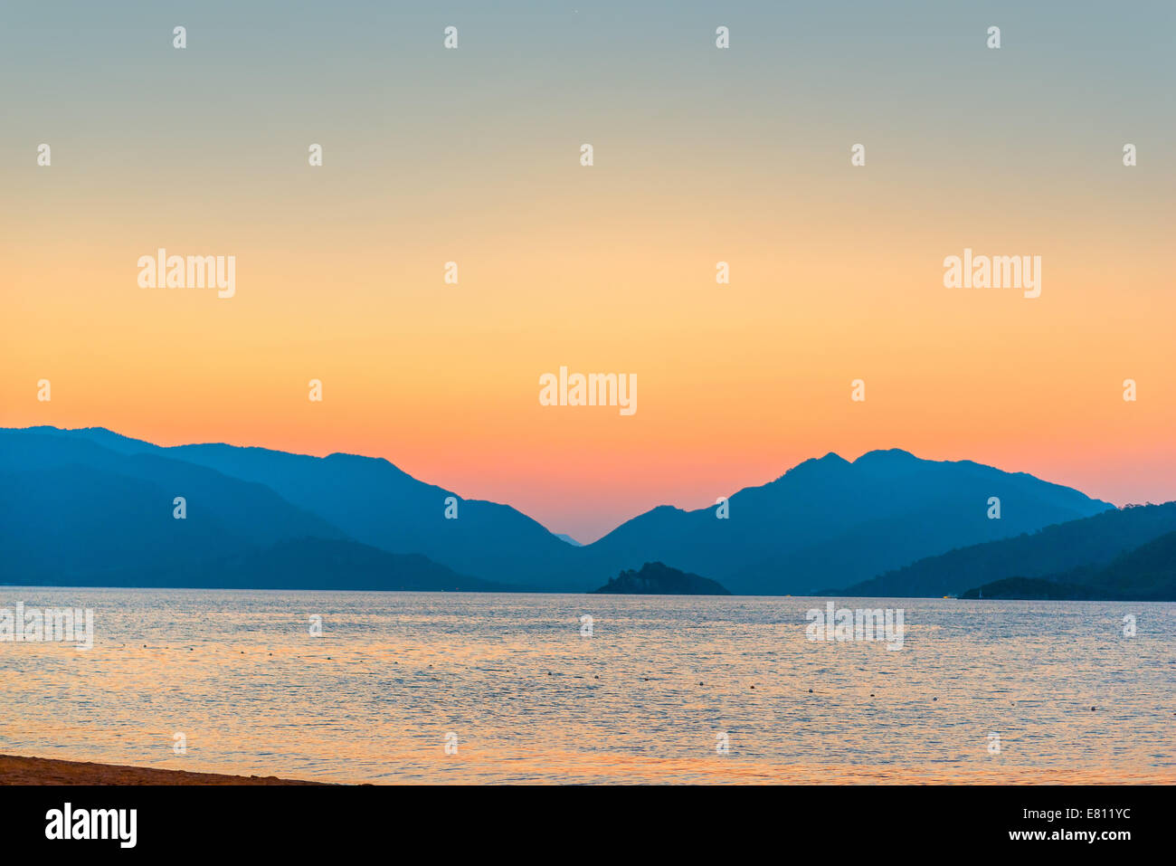 beautiful sunrise over the mountains over the sea Stock Photo - Alamy