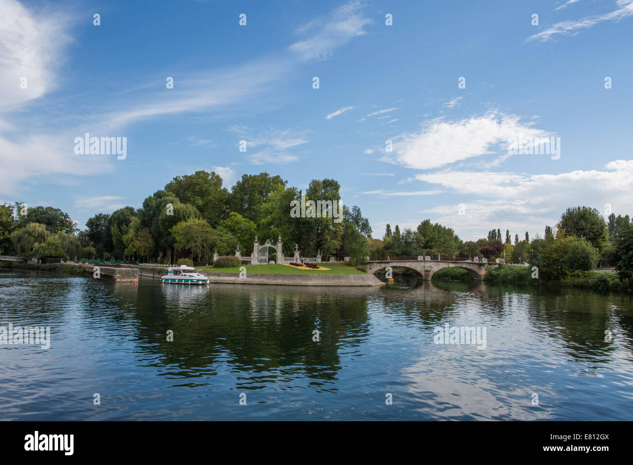 A pleasure boat heading towards Jarnac on the Charente river in France ...