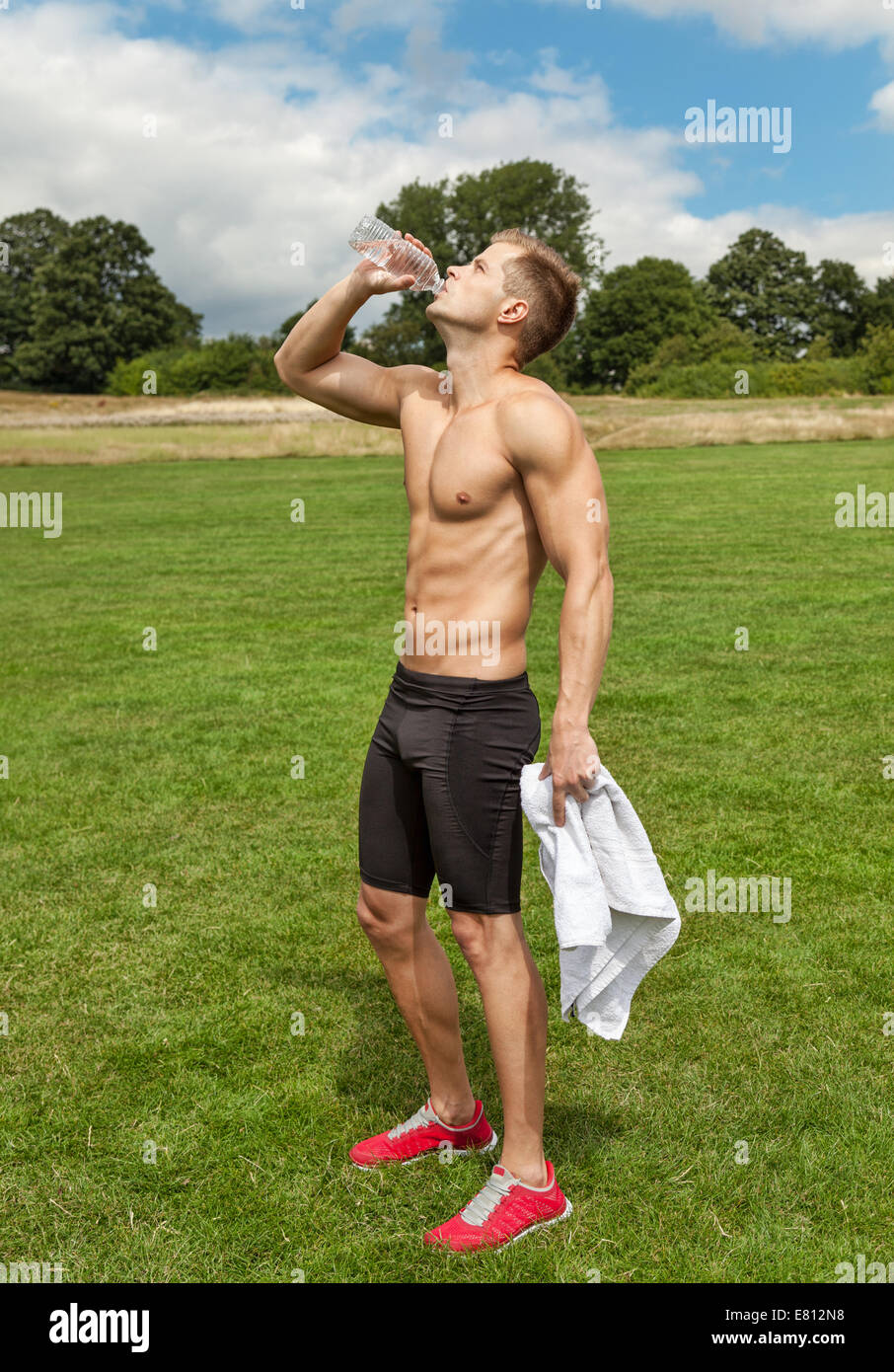 Keeping hydrated during workout outdoors Stock Photo - Alamy
