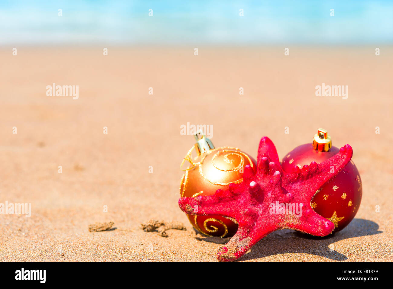 starfish and balls for the Christmas tree on the beach Stock Photo - Alamy