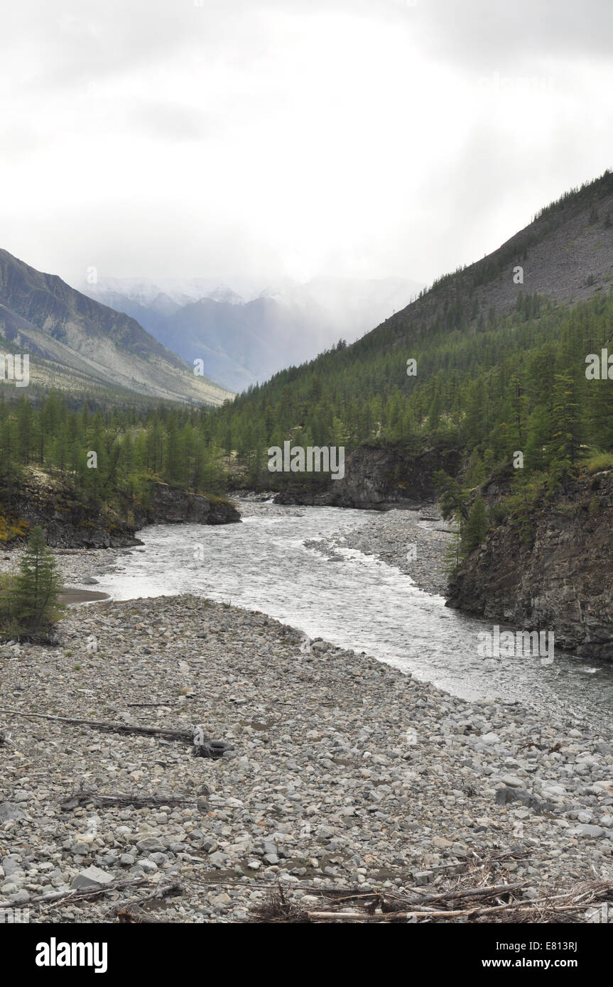The river in mountains of Yakutia. Cloudy landscape on a route Yakutsk ...