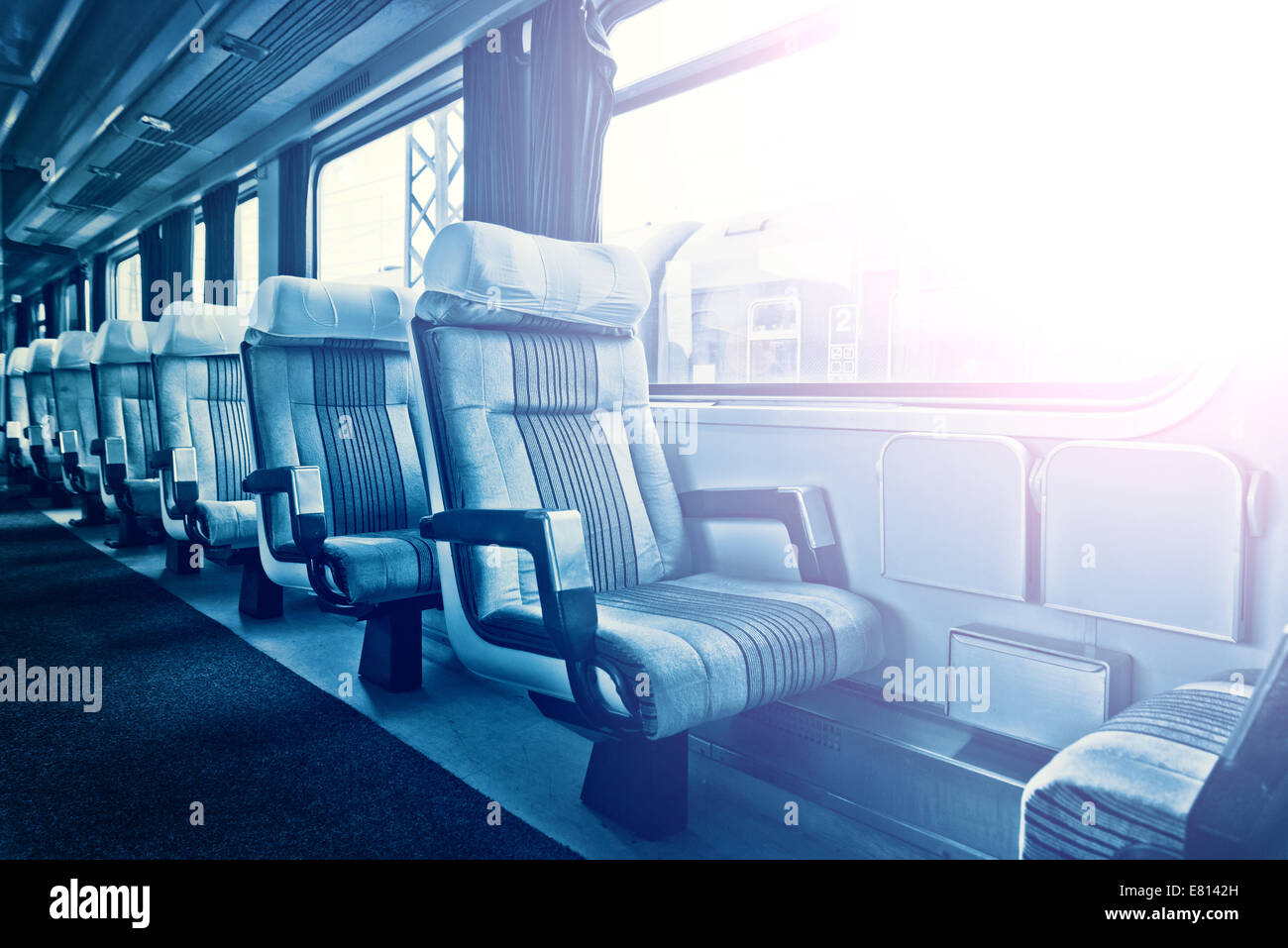 Interior of European economy class passenger train with empty seats ...