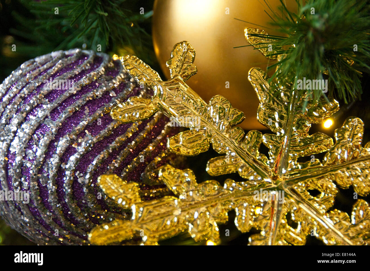 Horizontal close up of brightly coloured ornamental Christmas ...