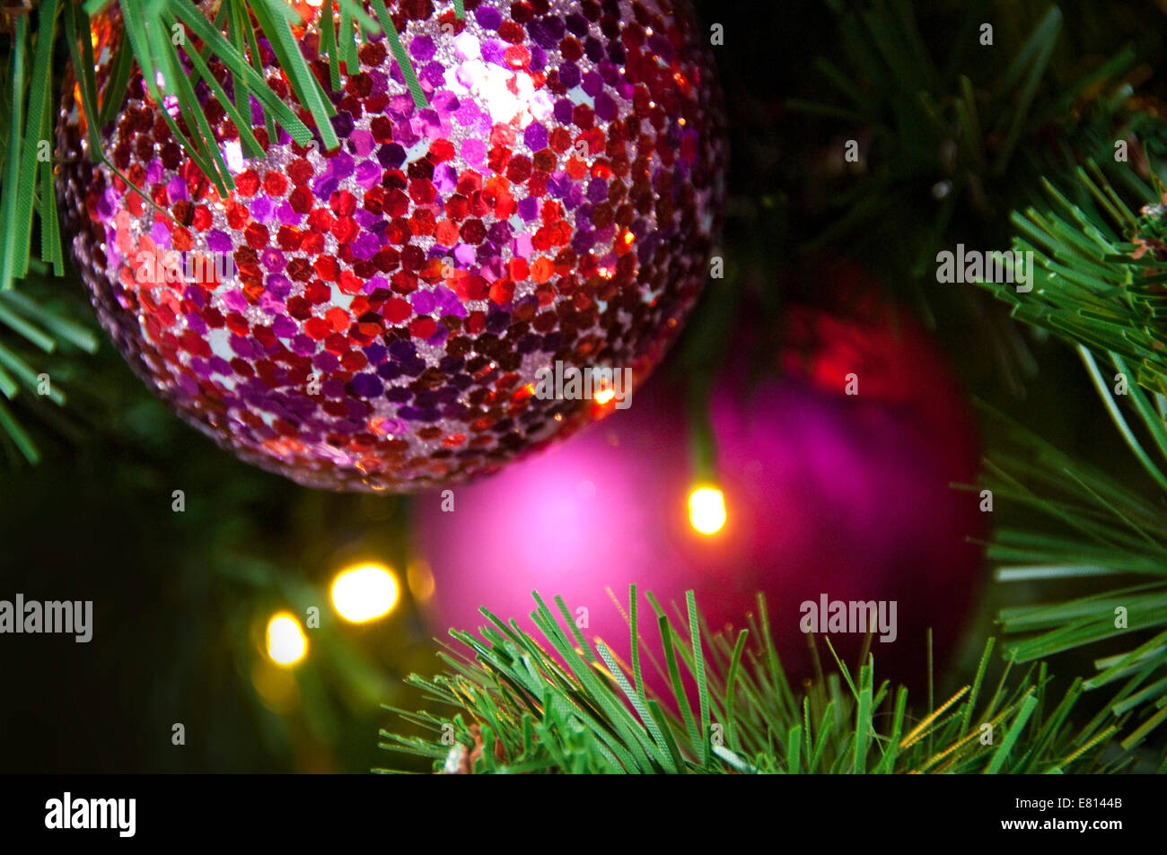 Horizontal close up of brightly coloured ornamental Christmas ...