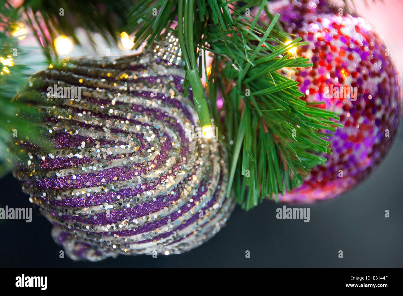 Horizontal close up of brightly coloured ornamental Christmas ...