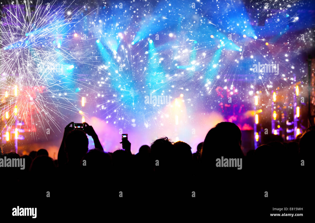 Fireworks and crowd celebrating the New year Stock Photo - Alamy