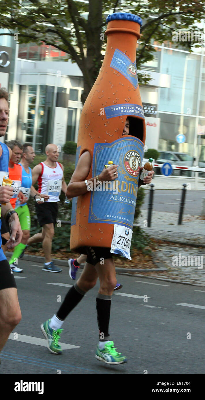 Berlin, Germany. 28th Sep, 2014. A participant dressed up as a beer ...