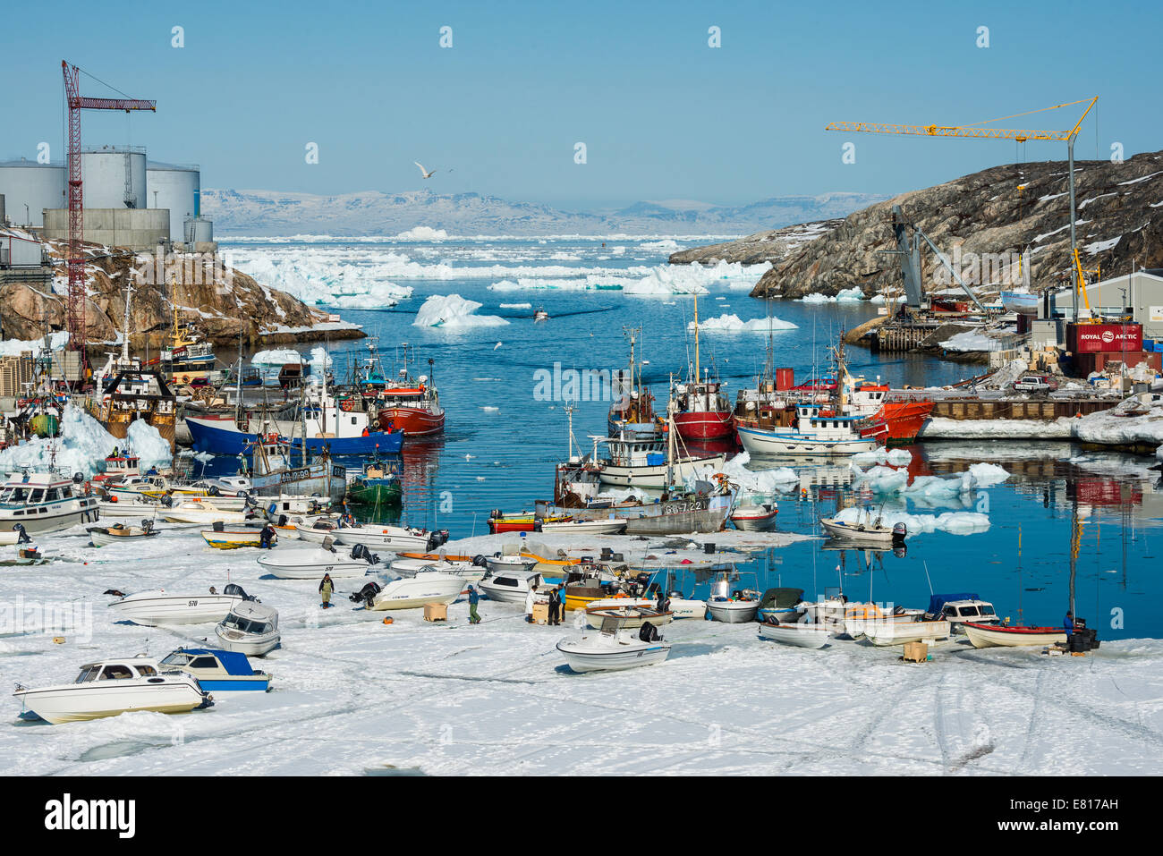 Boats moored in a snowy harbour Stock Photo - Alamy