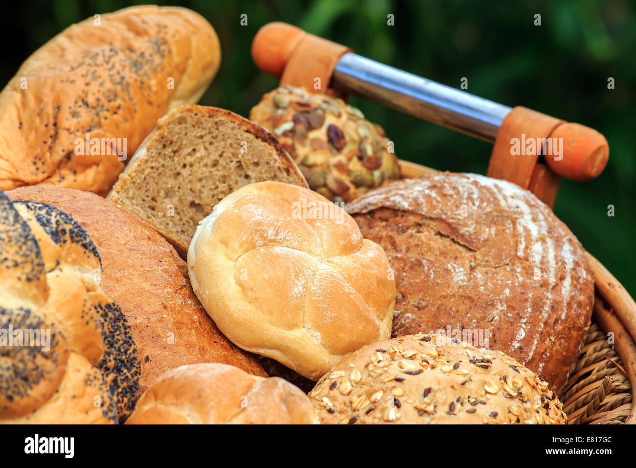 Basket full of different types of bread Stock Photo - Alamy