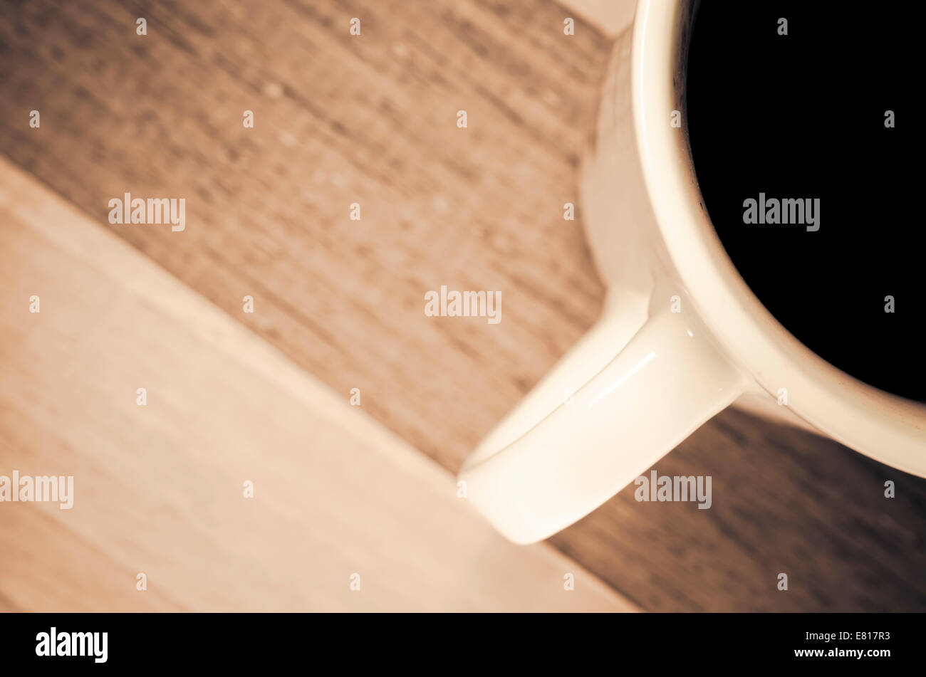 white porcelain long coffee cup on a wood surface Stock Photo - Alamy