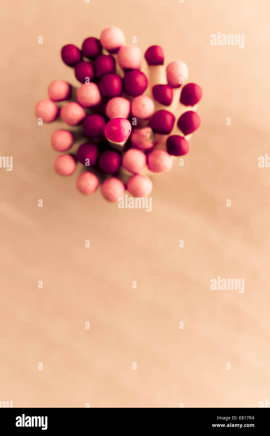 a set of matches on a light brown cardboard surface Stock Photo - Alamy