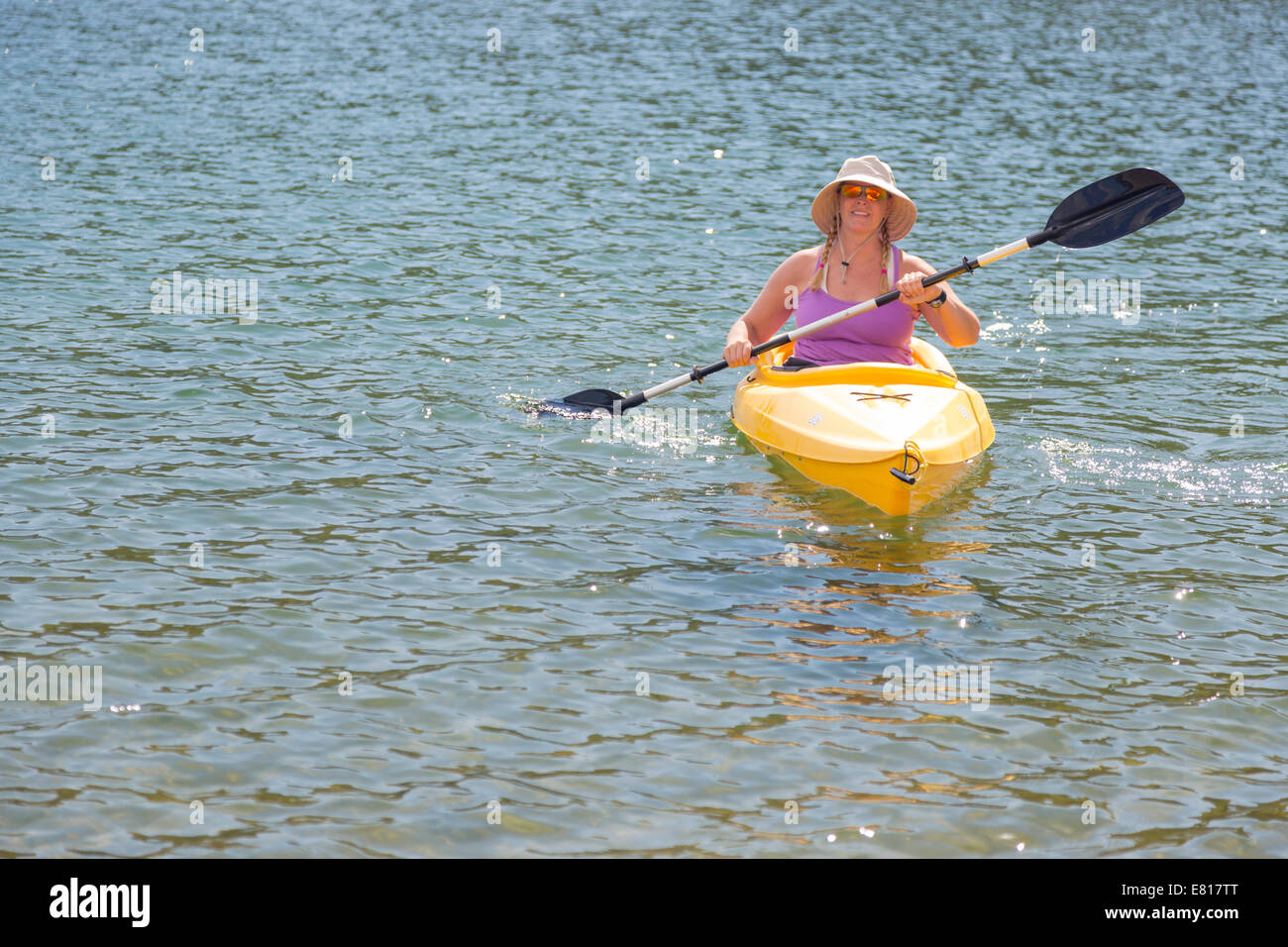Woman Kayaking on Beautiful Peaceful Mountain Lake Stock Photo - Alamy