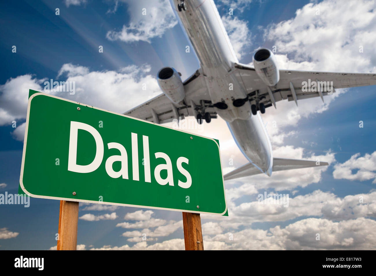 Dallas Green Road Sign and Airplane Above with Dramatic Blue Sky and ...