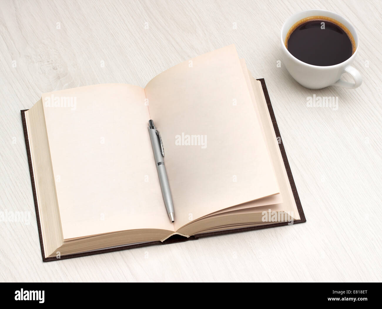 Close-up of open book and pen, coffe Stock Photo - Alamy