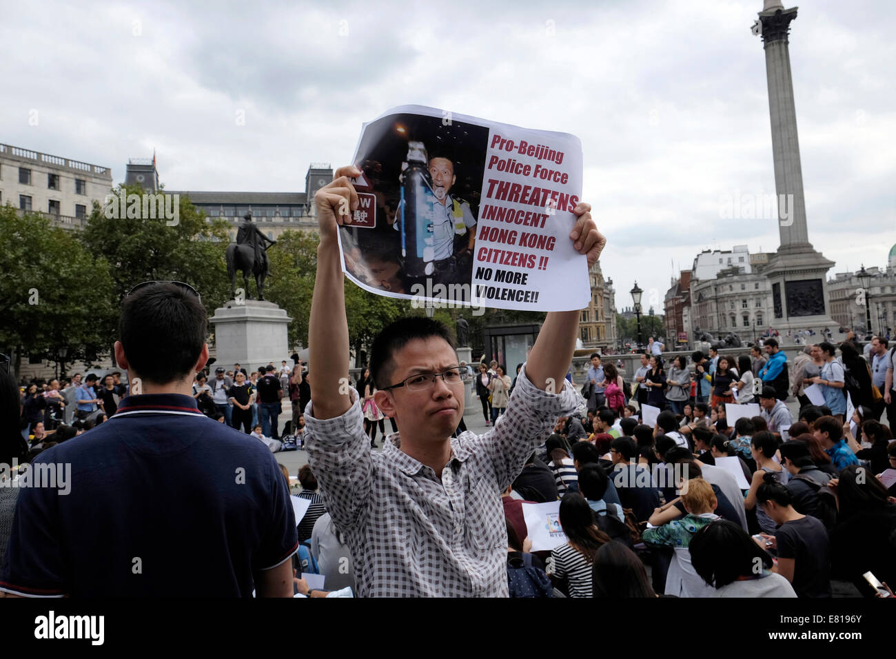 A student from Hong Kong holds a placard in support for pro-democracy ...