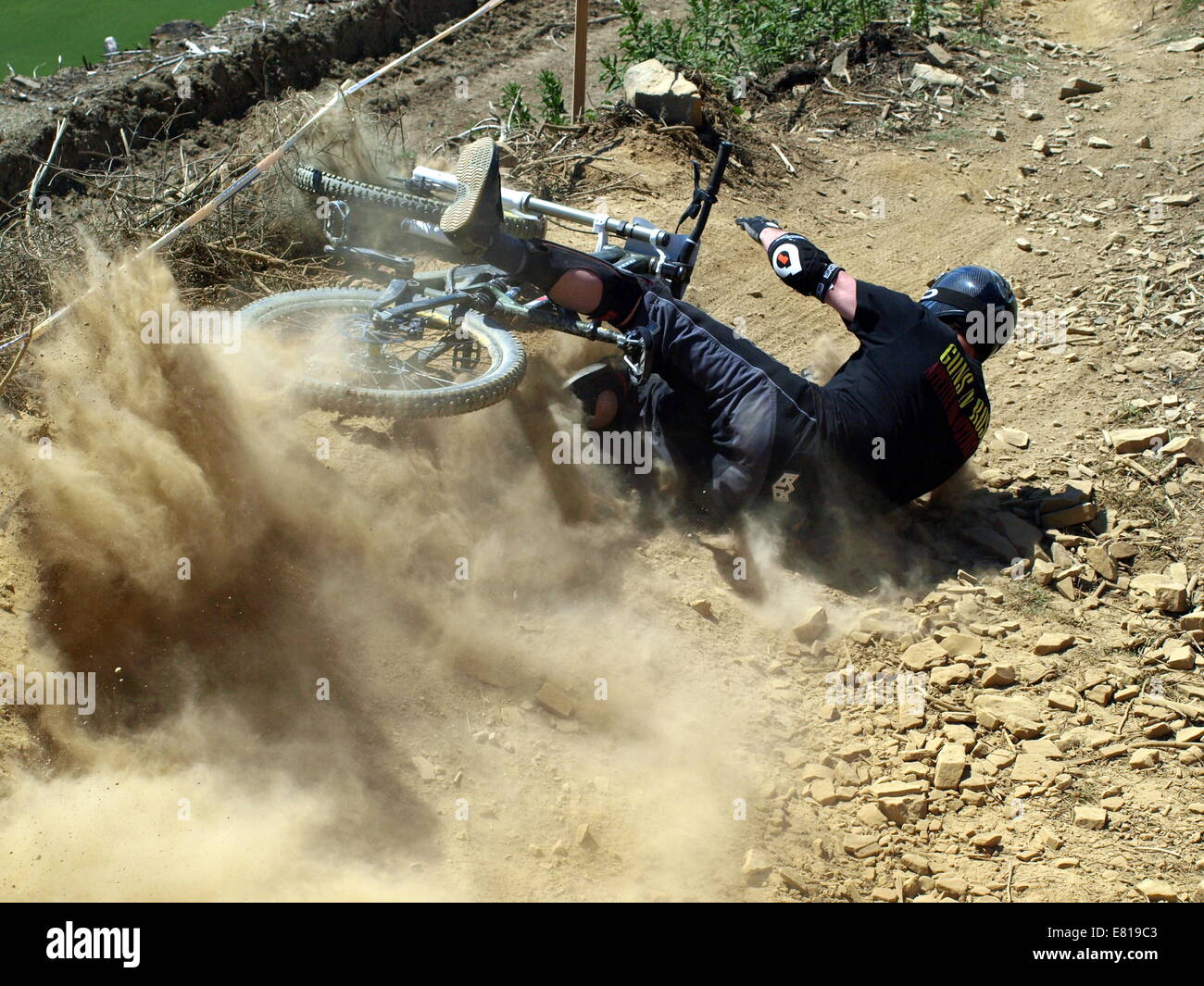 Downhill mountain biker crashing Stock Photo - Alamy